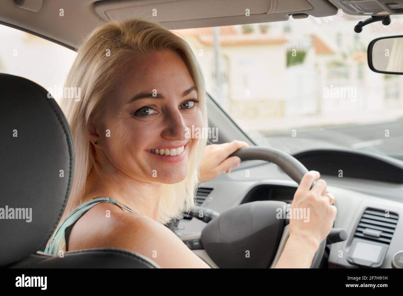 Woman driving car Stock Photo - Alamy