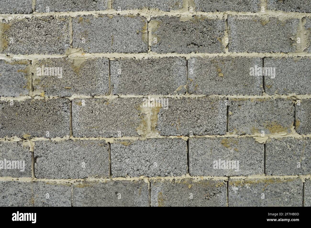 Fragment of a wall of gray rectangular concrete blocks Stock Photo - Alamy