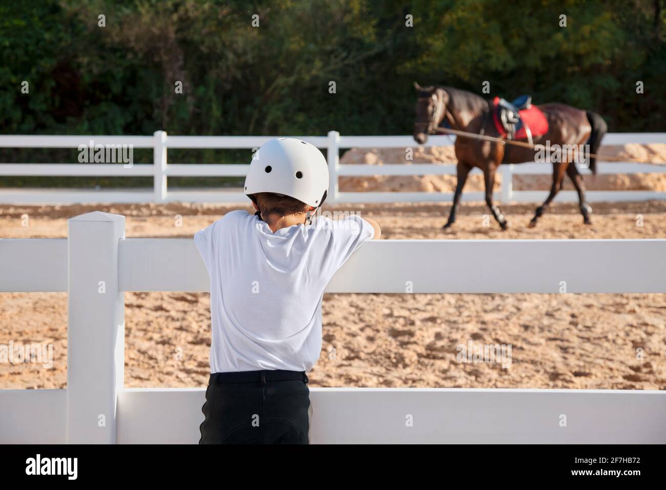 Black child riding horse helmet hi-res stock photography and images - Alamy
