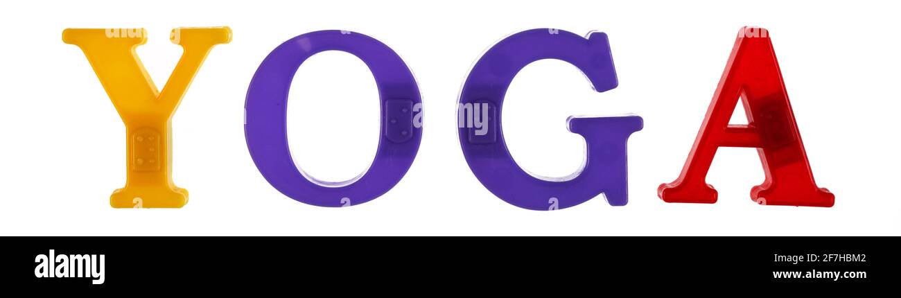 The word yoga is lined with multicolored plastic letters isolated on ...