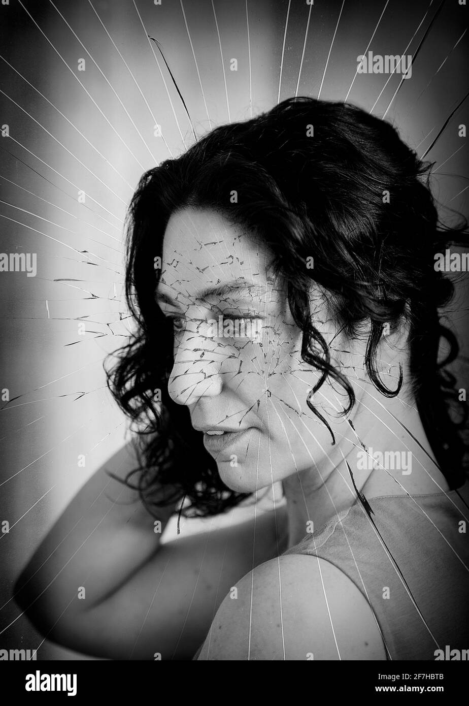 woman behind broken glass Stock Photo - Alamy