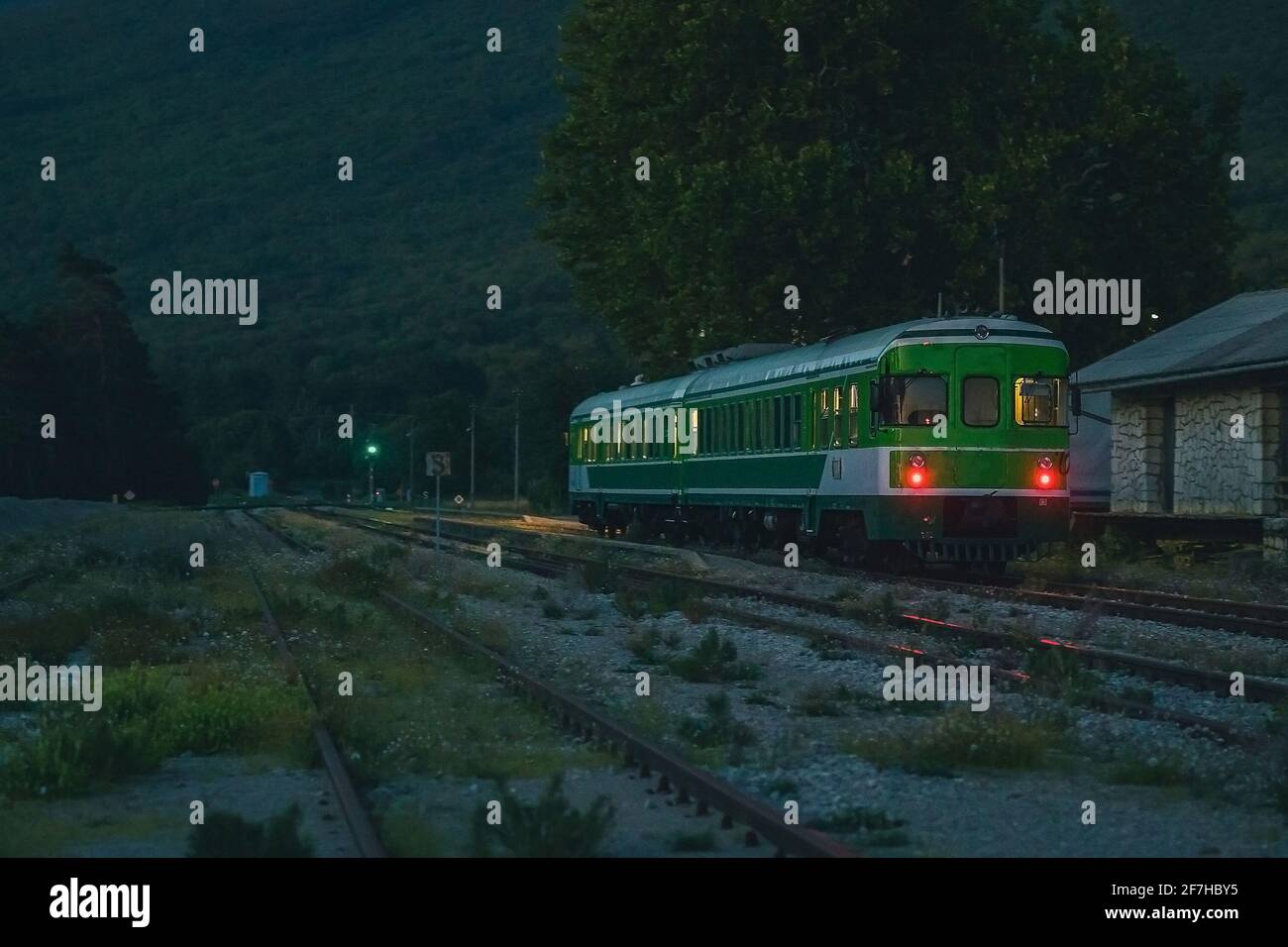 Older style diesel multiple unit DMU train in white and green color in ...