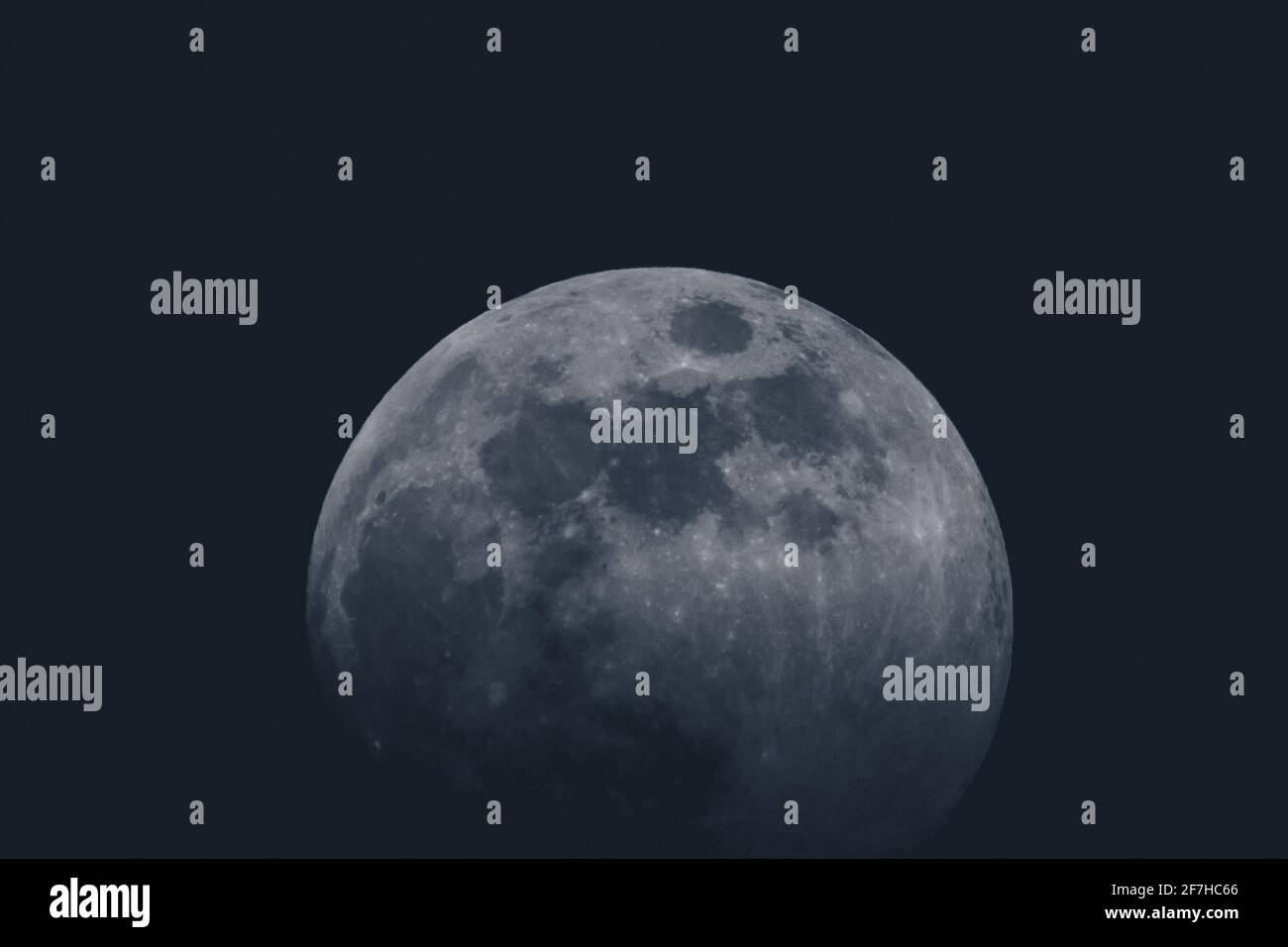 Full moon over dark background sky. Closeup of a moon on the sky, with ...