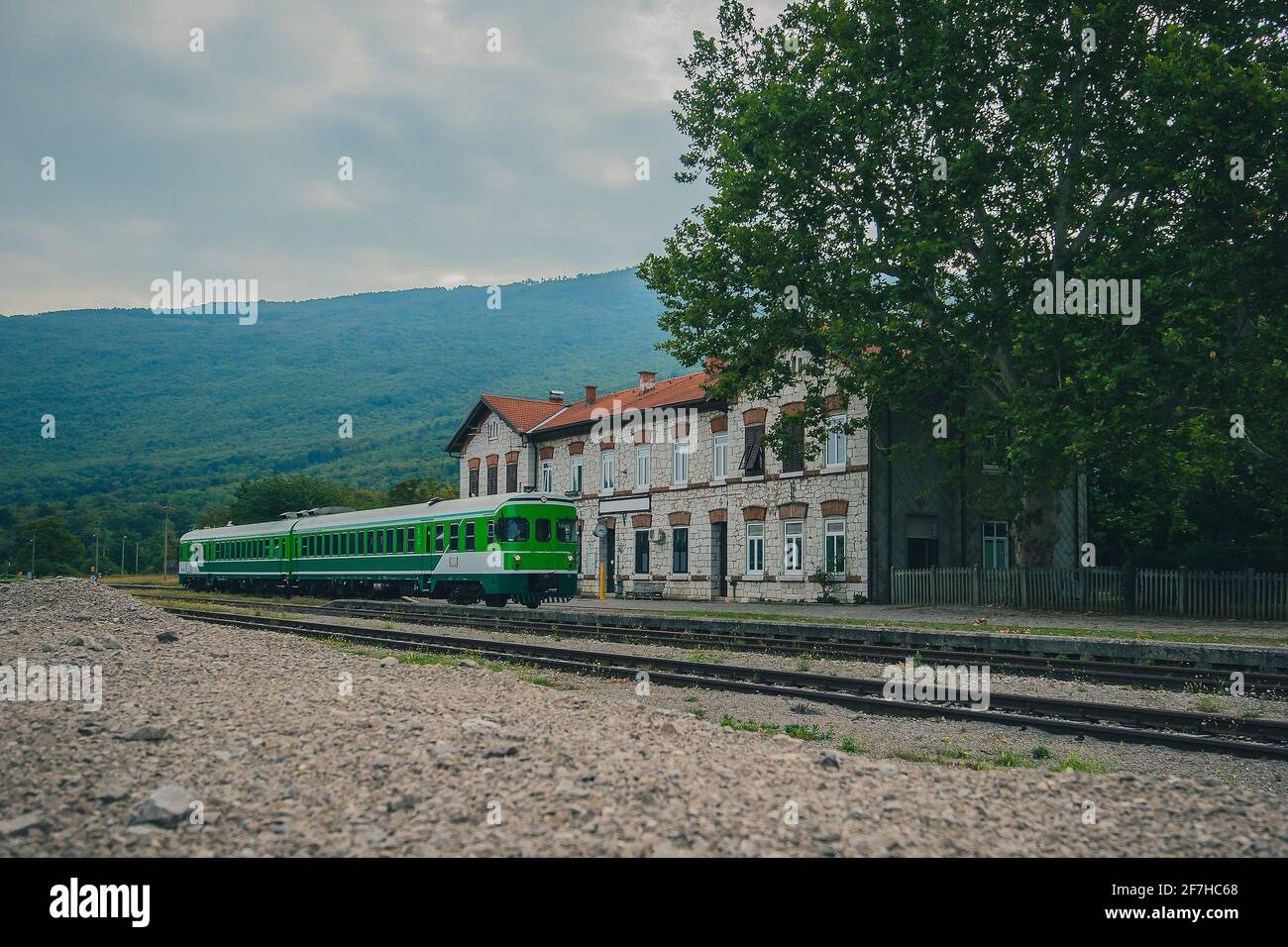 Older style diesel multiple unit DMU train in white and green color in ...