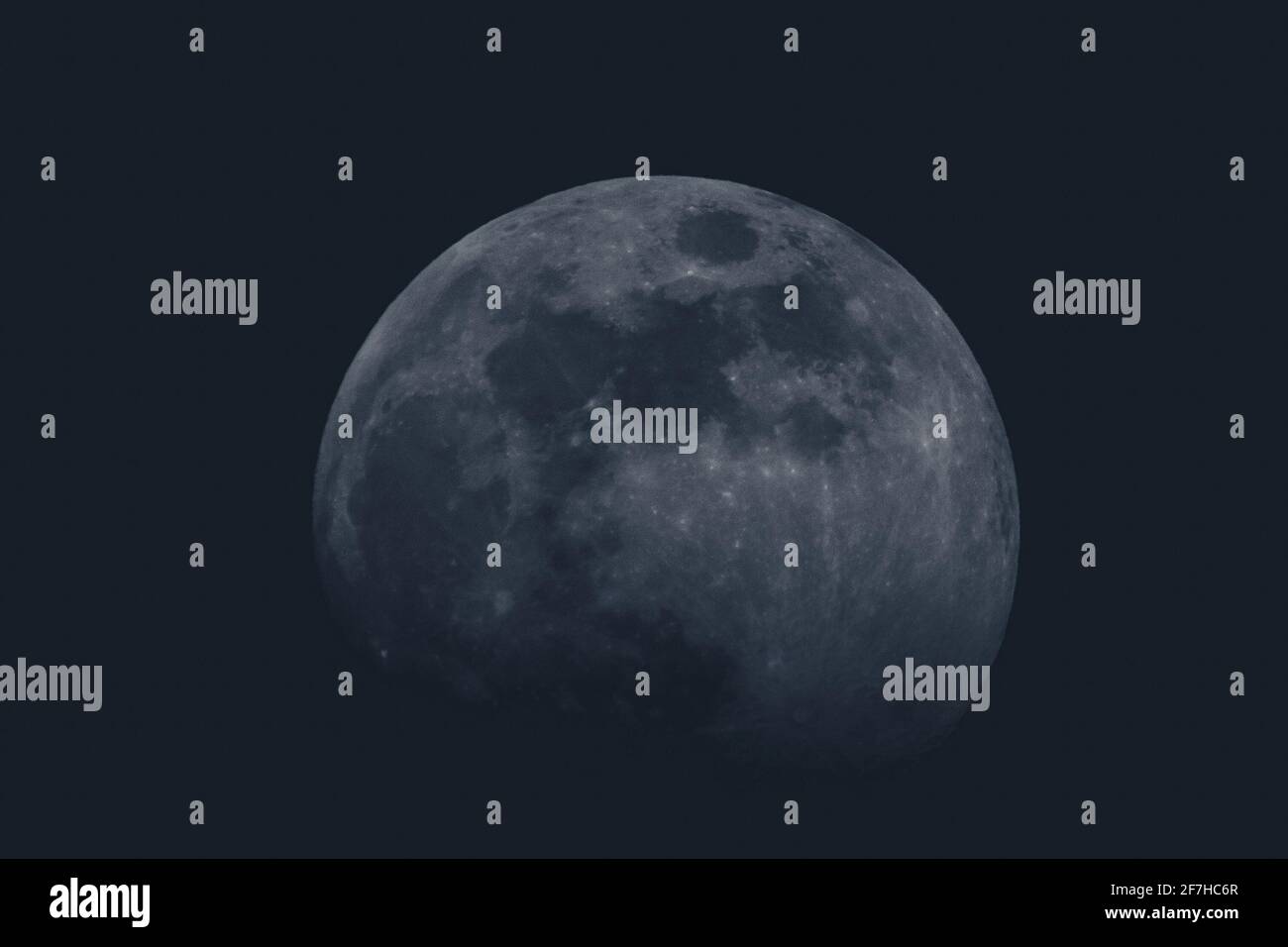 Full moon over dark background sky. Closeup of a moon on the sky, with ...