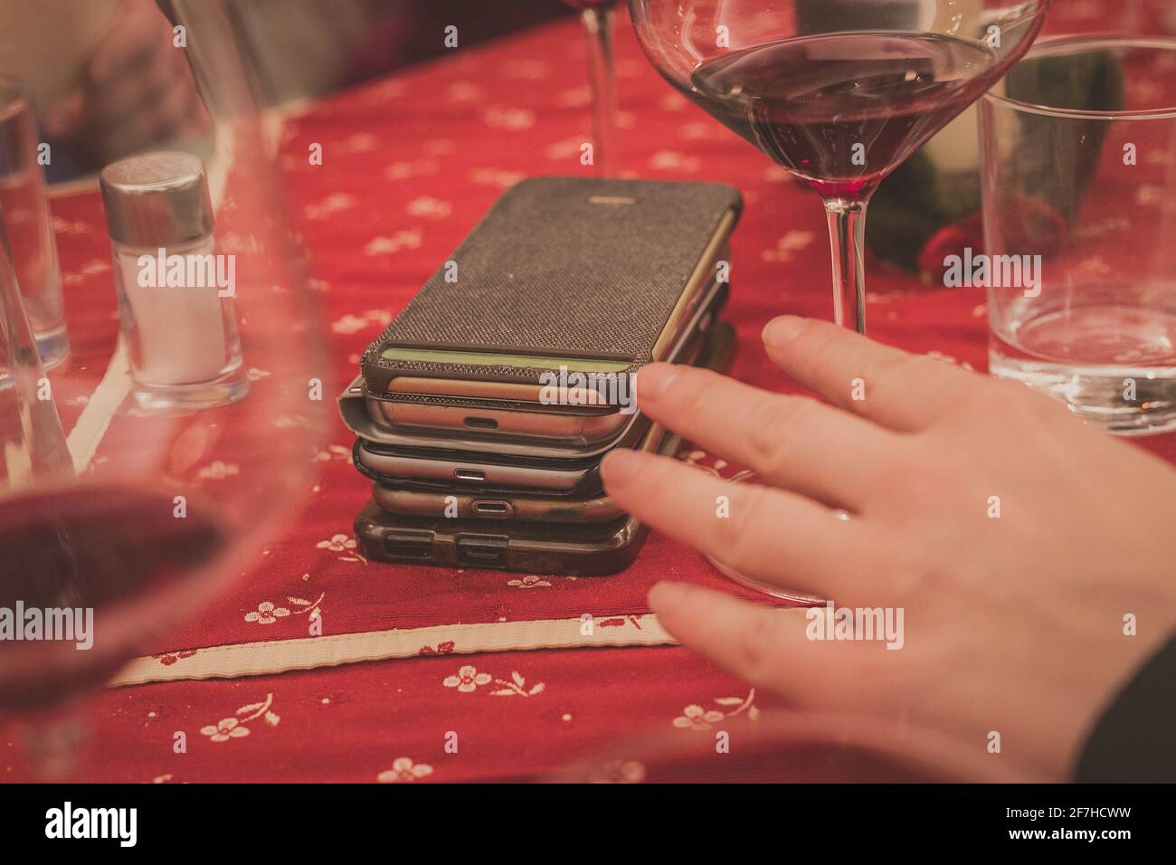 Game of stacking the telephones on one each other. Mobile phones one on ...