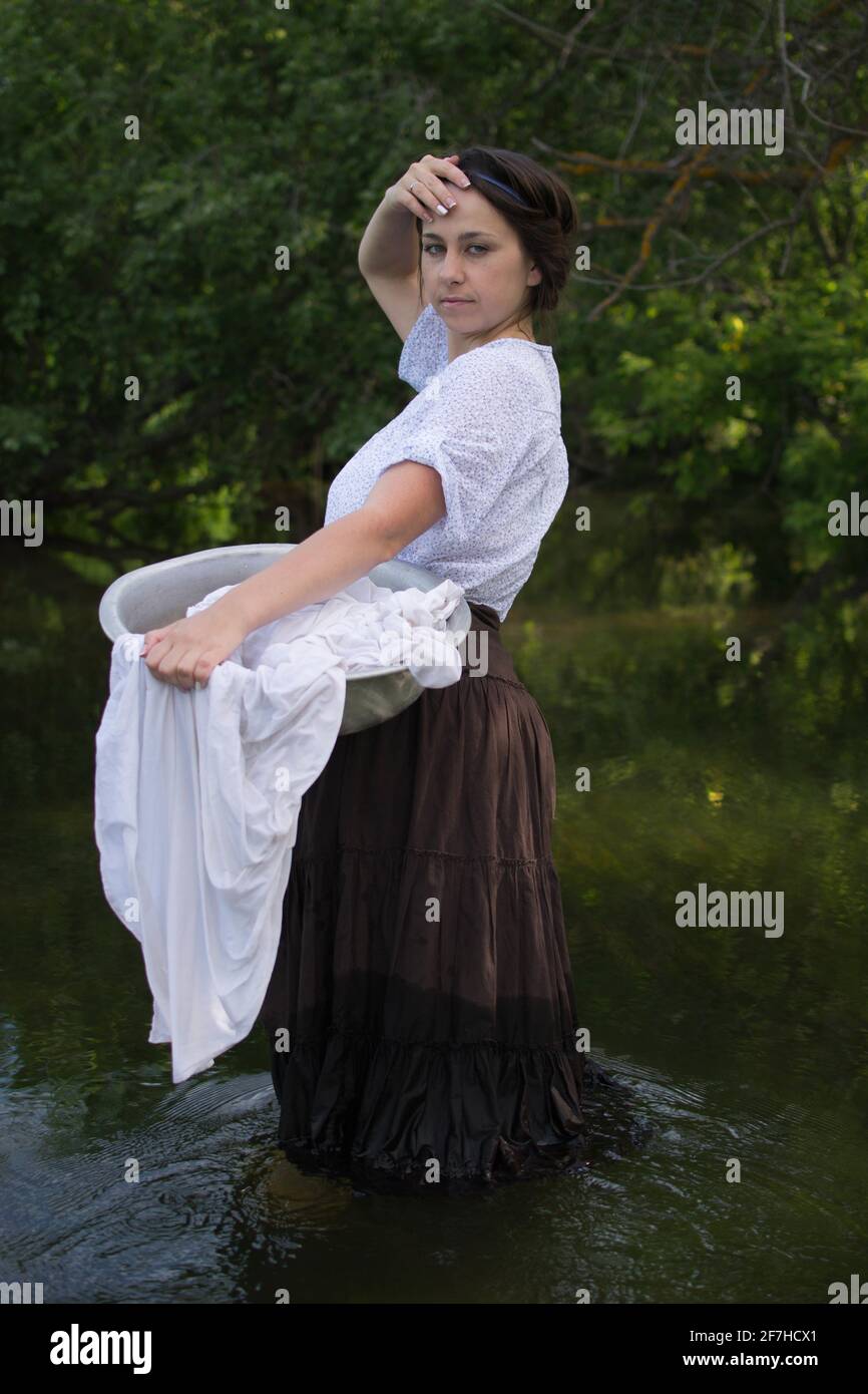 Rinsing clothes hi-res stock photography and images - Alamy