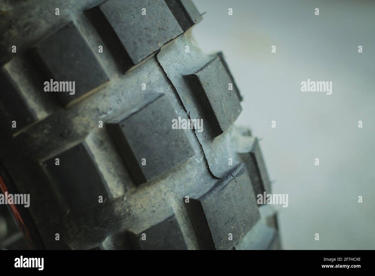 Detail of an offroad off road motorcycle tire mounted on a rear rim ...