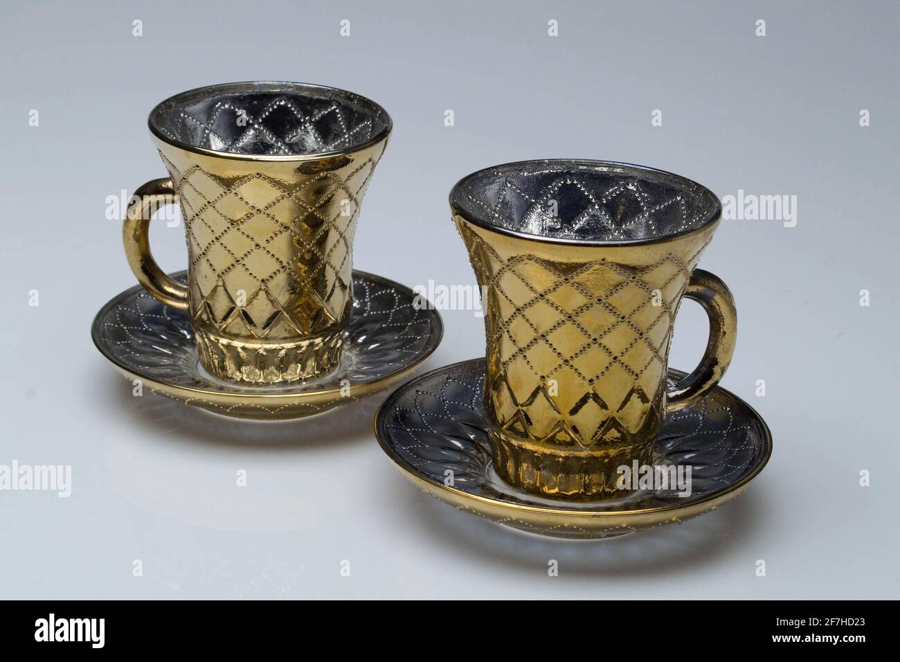 Vintage gold cup for tea and coffee Stock Photo - Alamy