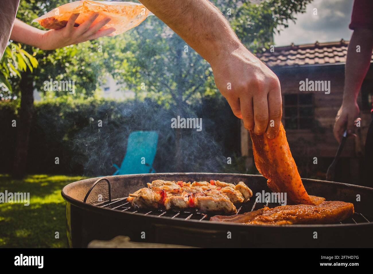 Laying bacon on grill hi-res stock photography and images - Alamy