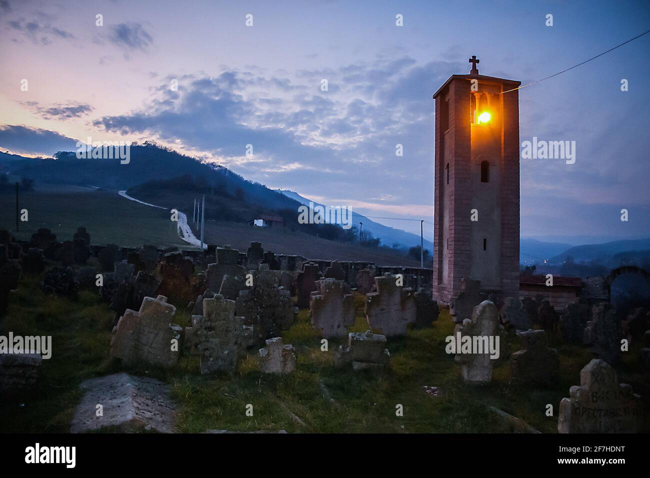 Scary looking cemetery in Serbia with a spooky road and village seen in ...
