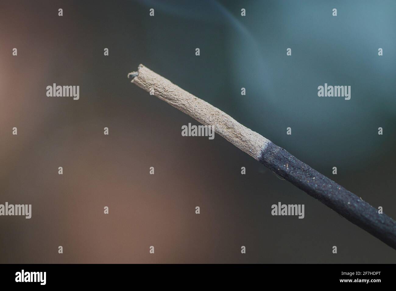 Macro or close up photo of a single scented stick burning on a ...