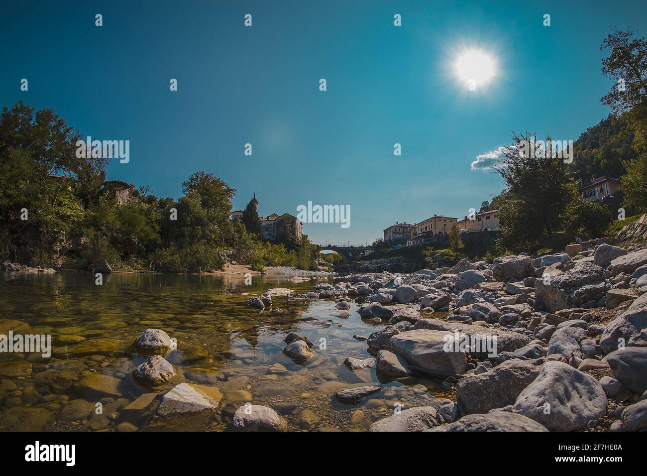 Famous bridge on Kanal ob Soci village during hot summer day with cold ...