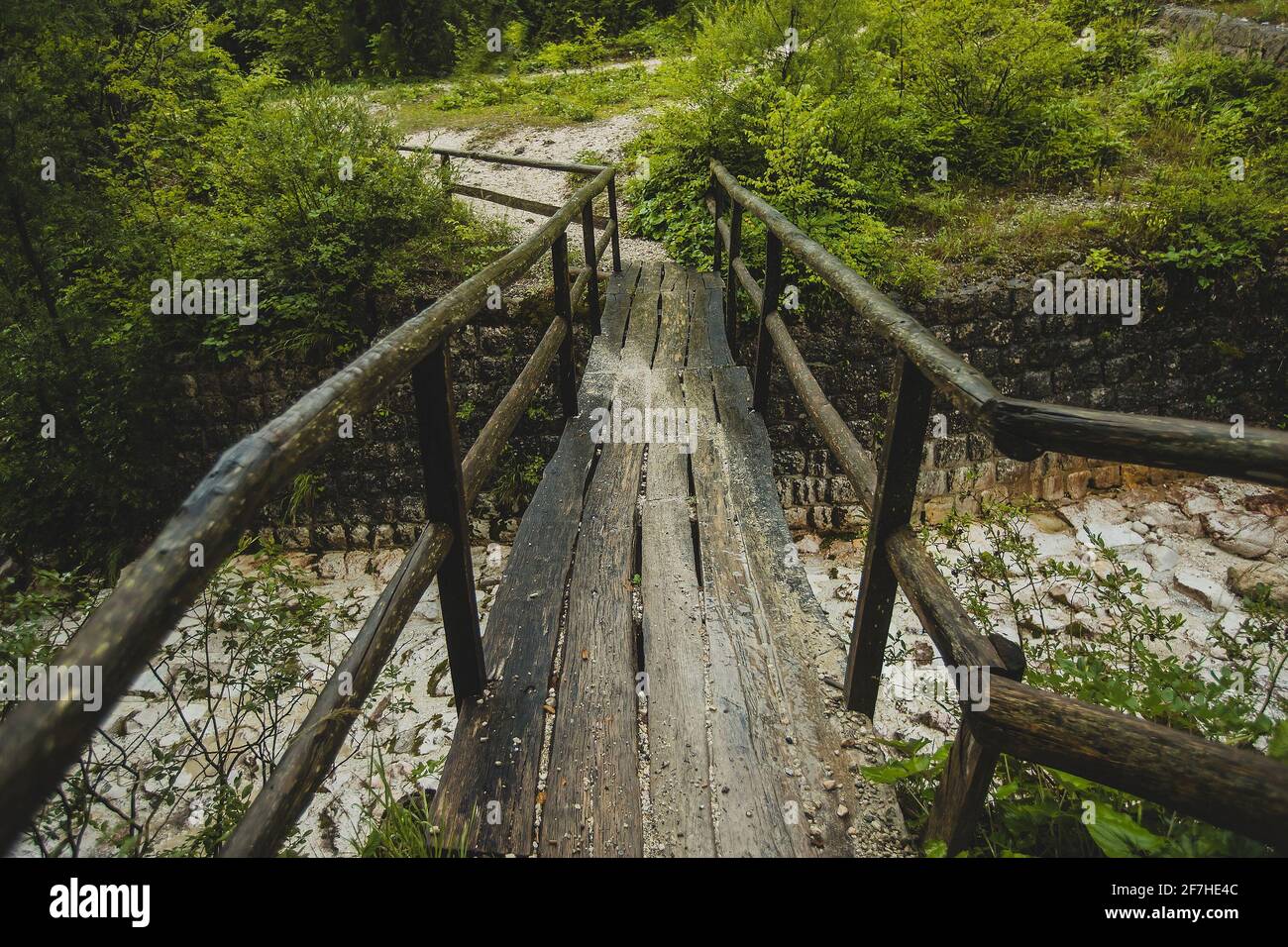 Slippery and dangerous wooden bridge for pedestrians in a countryside ...