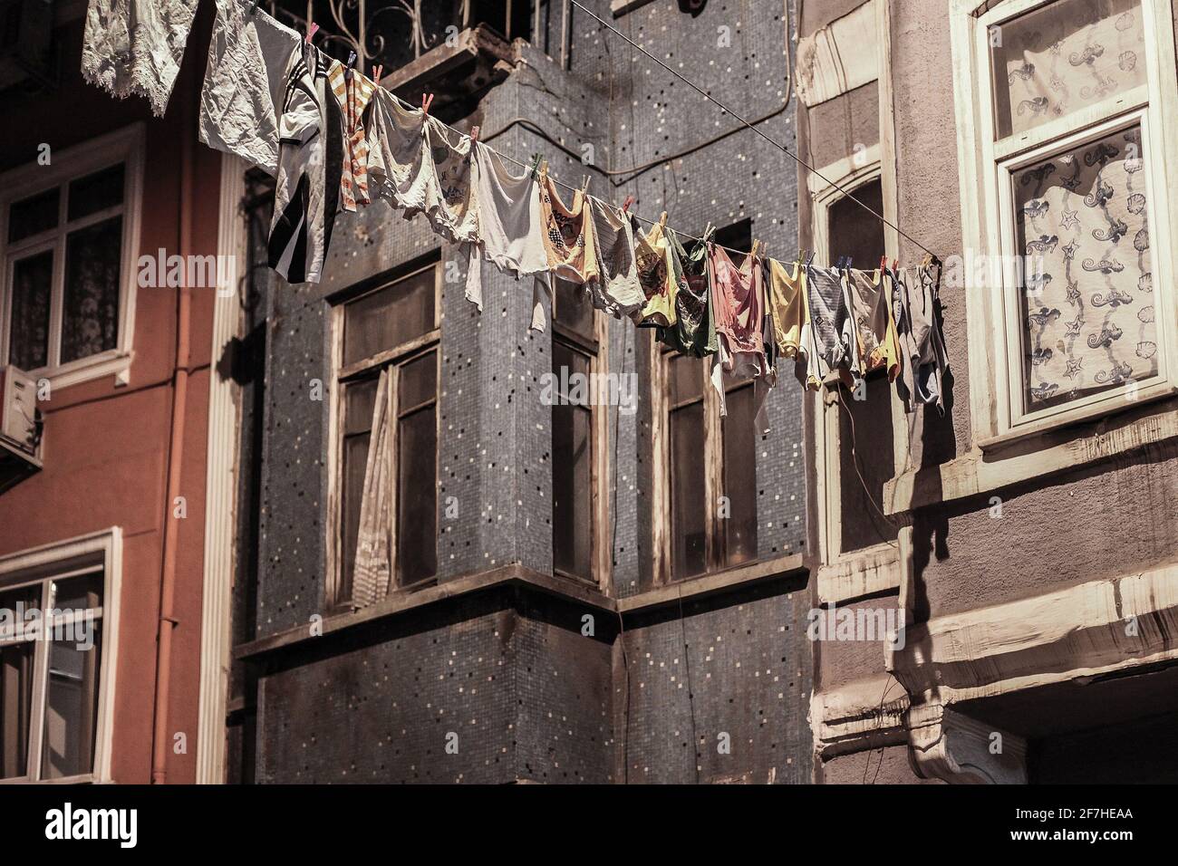 Drying the clothes on a washing line in the urban part of the city ...