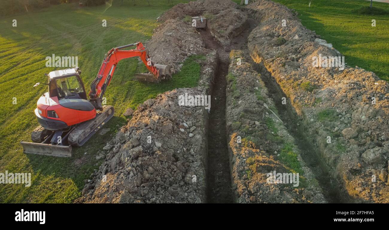 Aerial drone view of geothermal heating collector pit or trench in the ...