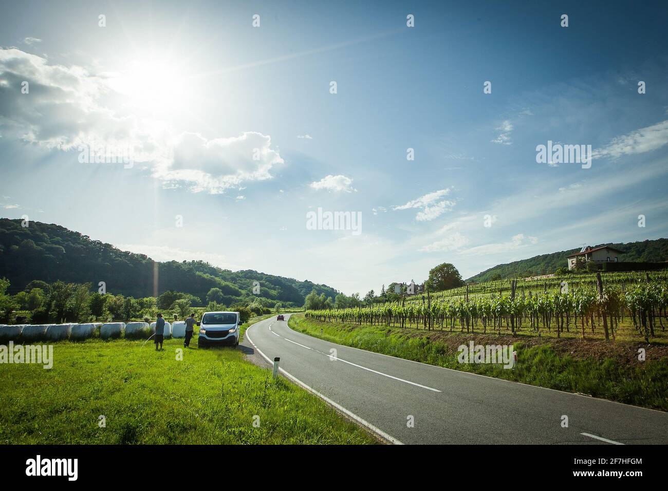 White van stopped at the road side to allow passengers to go on a ...