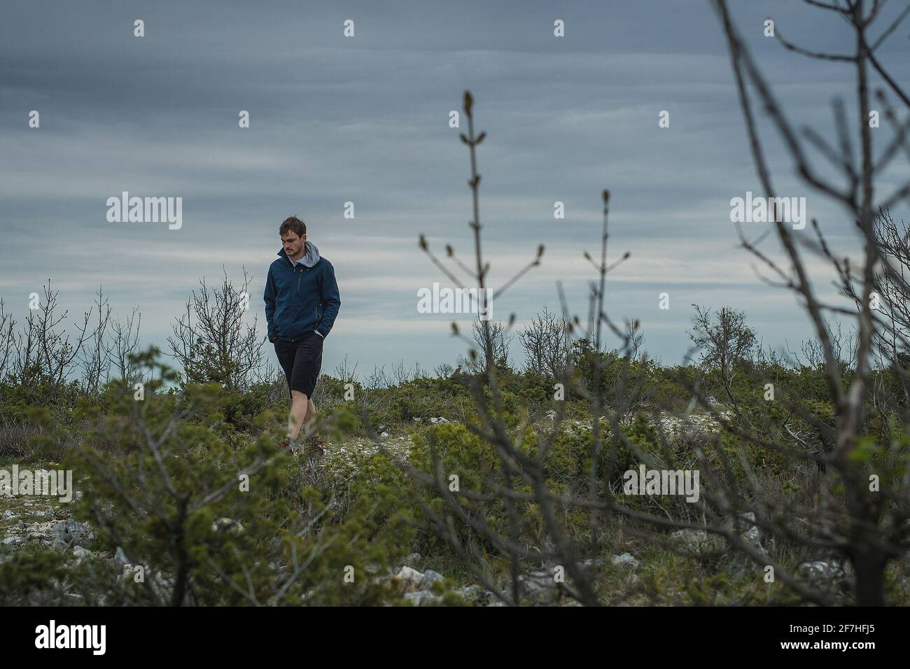 Man in depression with suicidal tendencies walking through mellow ...
