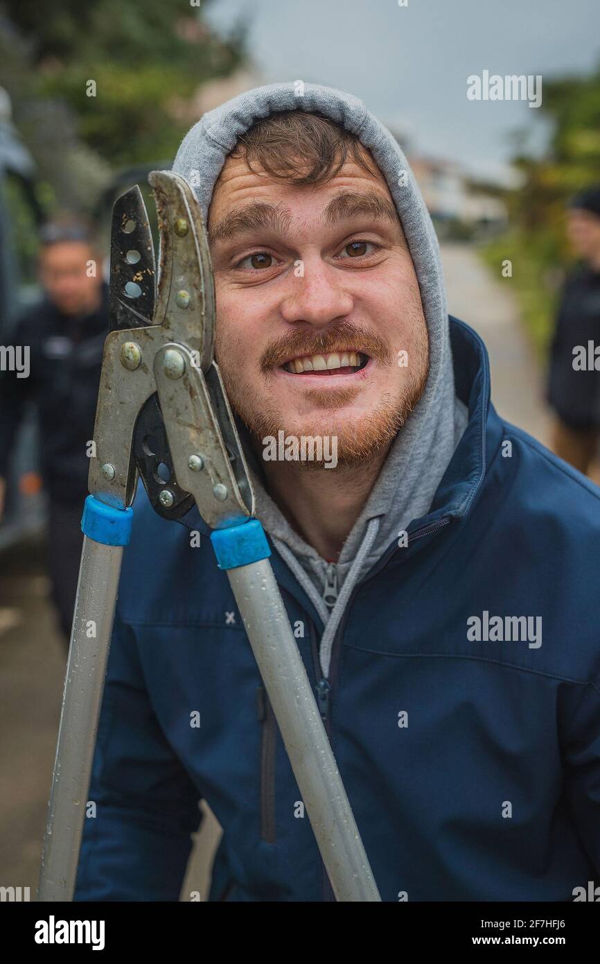 Crazy deranged man with long pruning scissors in his hands attacking ...