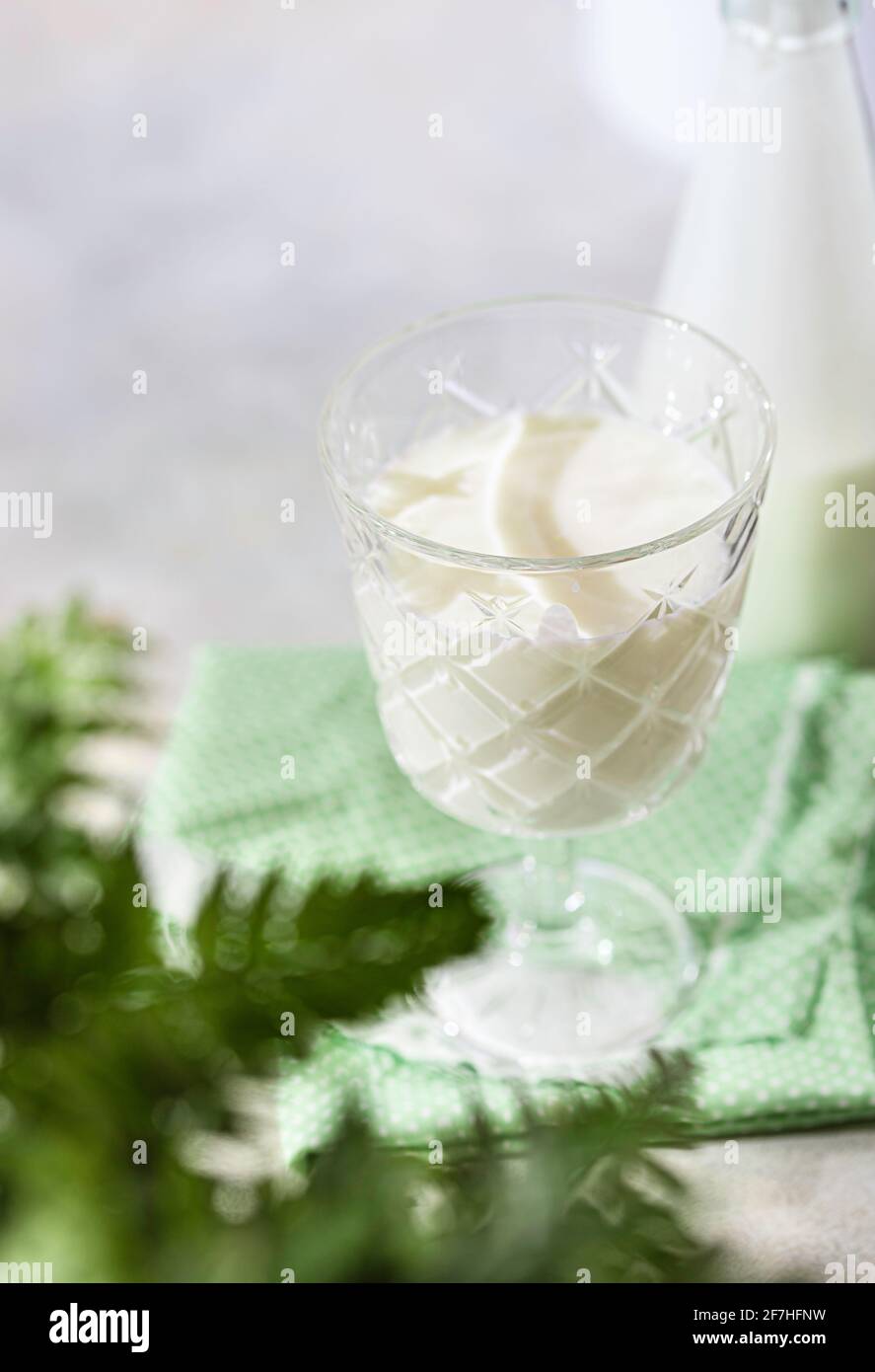 Fermented drink kefir, yogurt in a glass jar on a light background ...