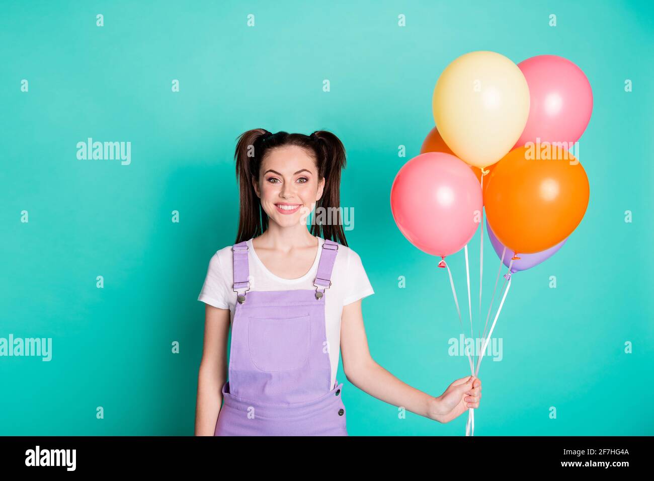 Photo of charming student girl hold balloons ponytails hairdo wear ...