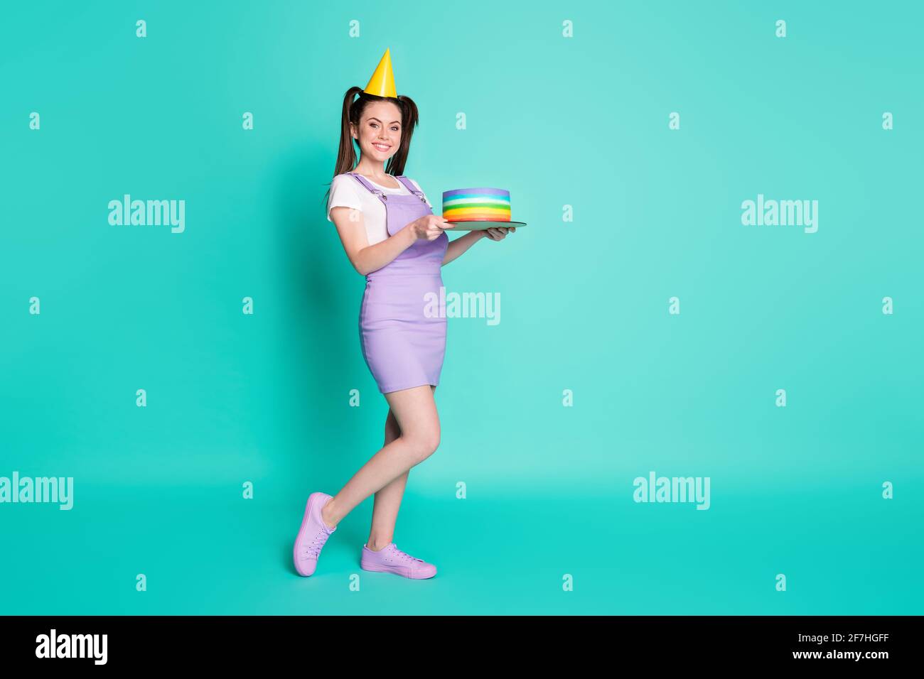Full length body size photo of happy birthday girl keeping cake wearing ...