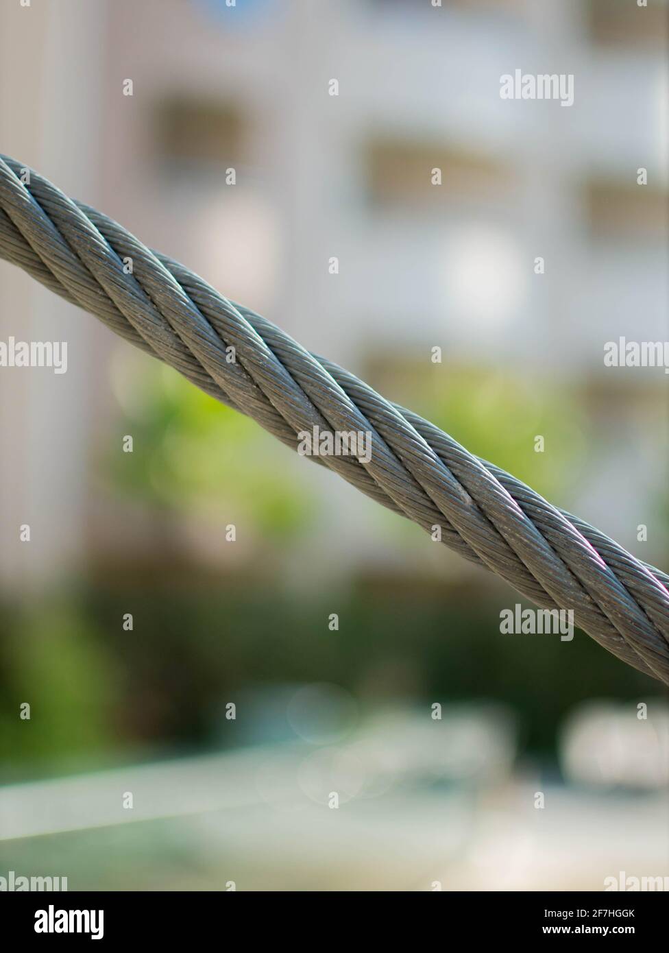 thick metal cable on a blurred background Stock Photo - Alamy