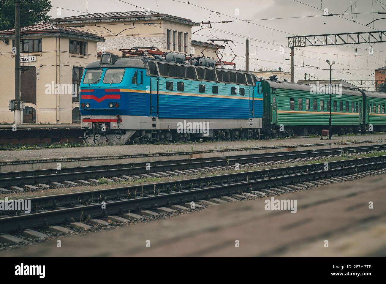 Ukrainian passenger train on the station of Zhmerynka during a small ...