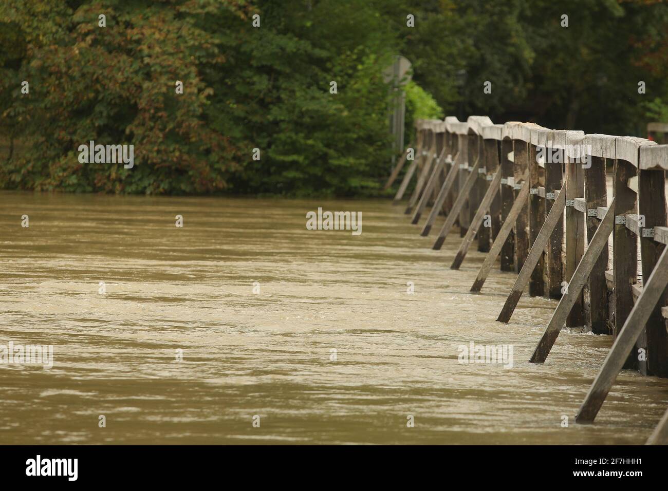 Flooded wooden trestle bridge with road, due to heavy rain and bad ...