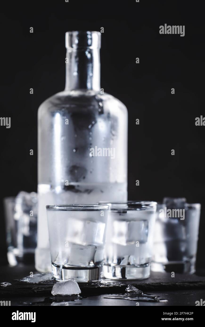 Cold Vodka in shot glasses on black background, ready to drink Stock ...