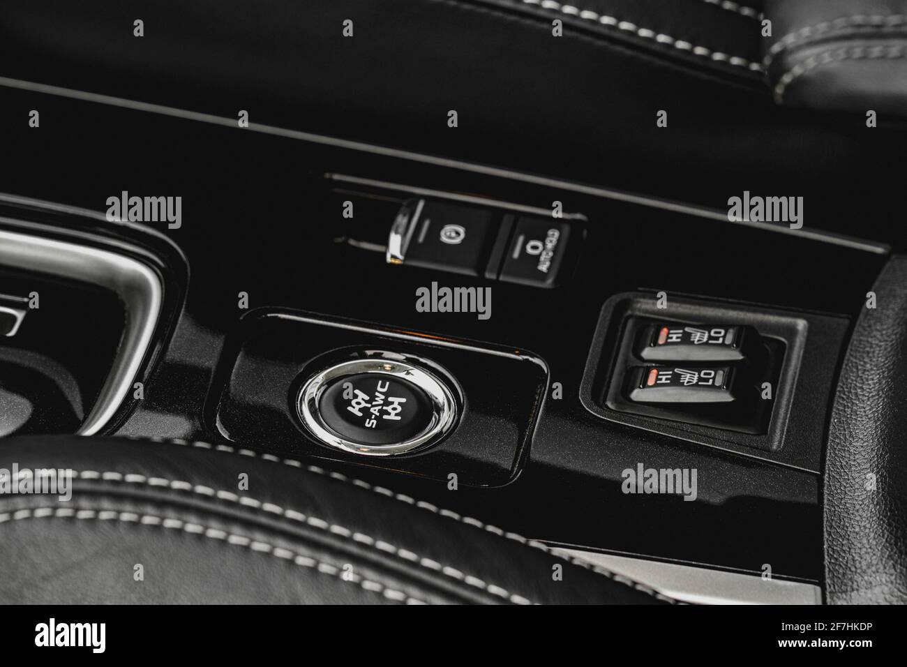 Seat heating and Super All Wheel controller buttons close up view. Car ...