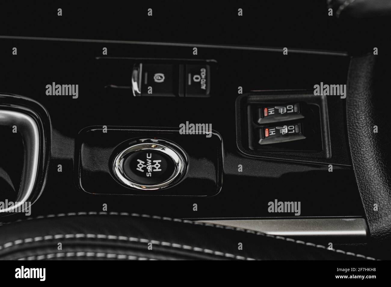 Seat heating and Super All Wheel controller buttons close up view. Car ...