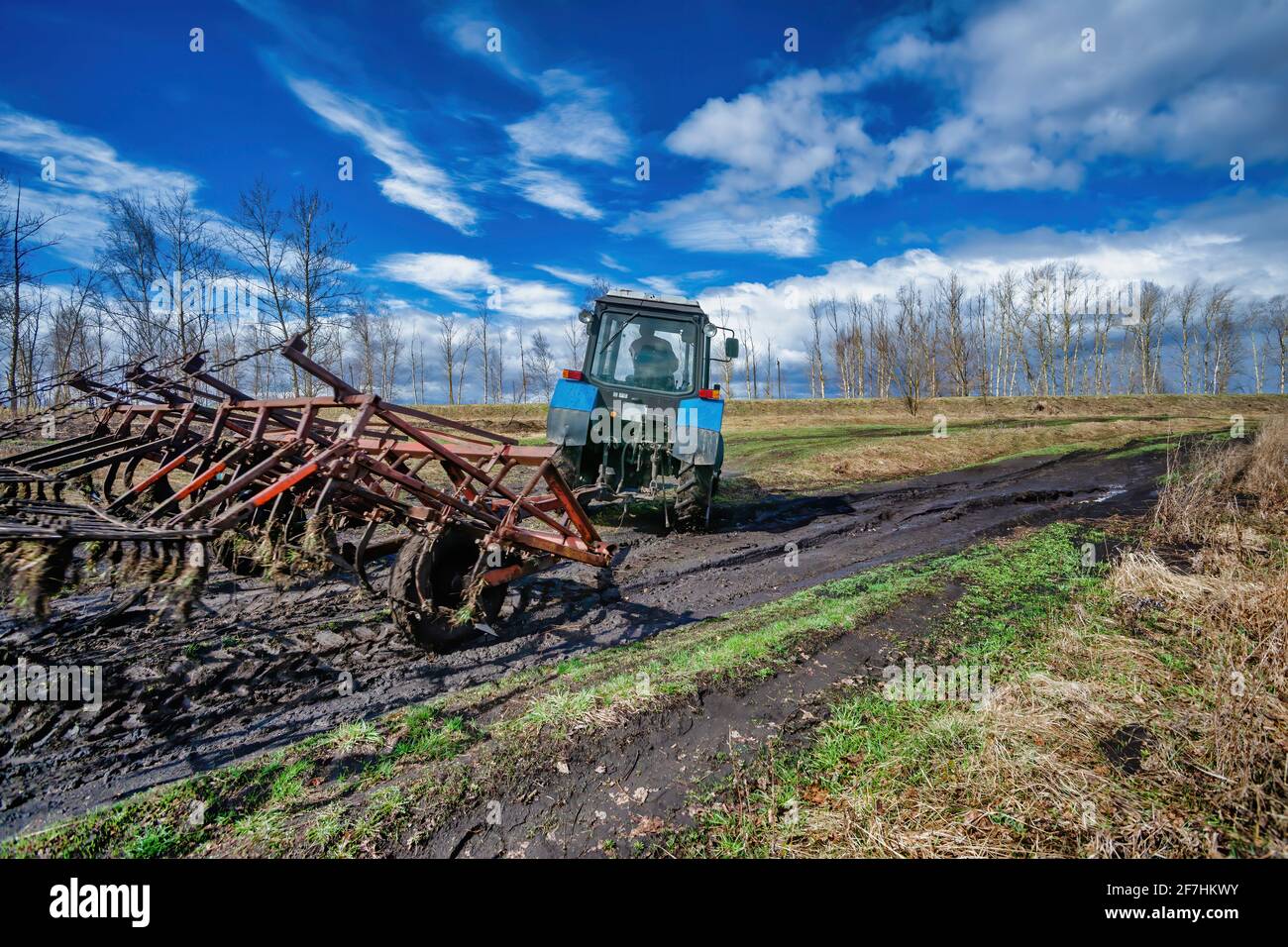 Seasonal agricultural works on tractor among the fields Stock Photo - Alamy