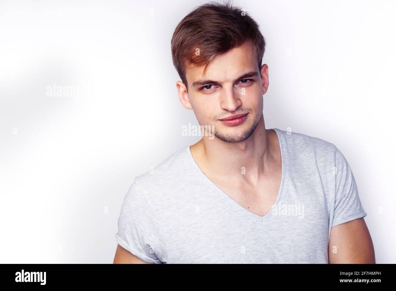 young handsome teenage hipster guy posing emotional, happy smiling ...