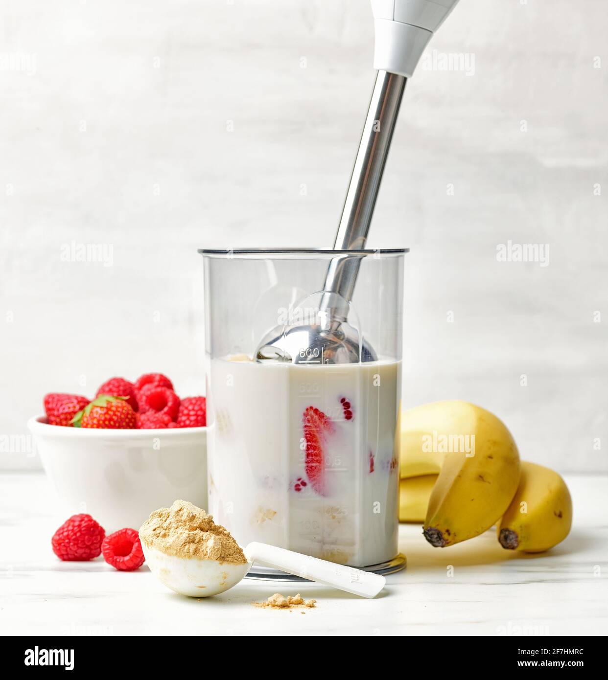 process of making healthy breakfast milkshake of banana and fresh ...