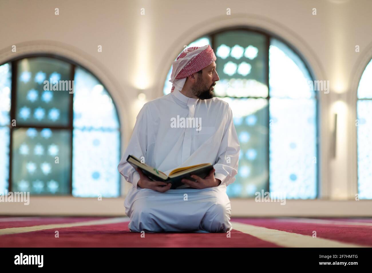 muslim man praying Allah alone inside the mosque and reading islamic ...