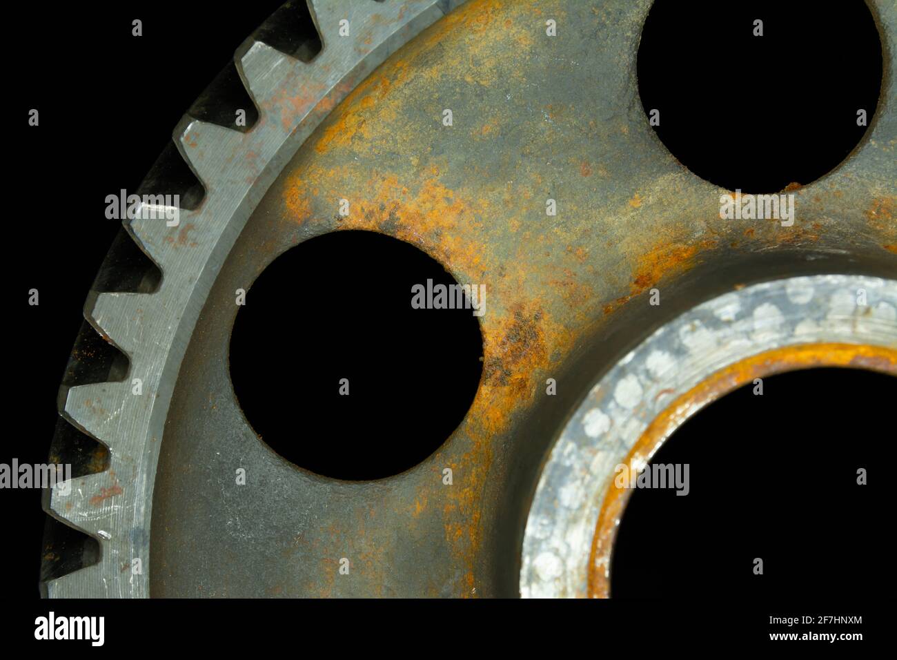 Rusted metal gear with black background Stock Photo - Alamy