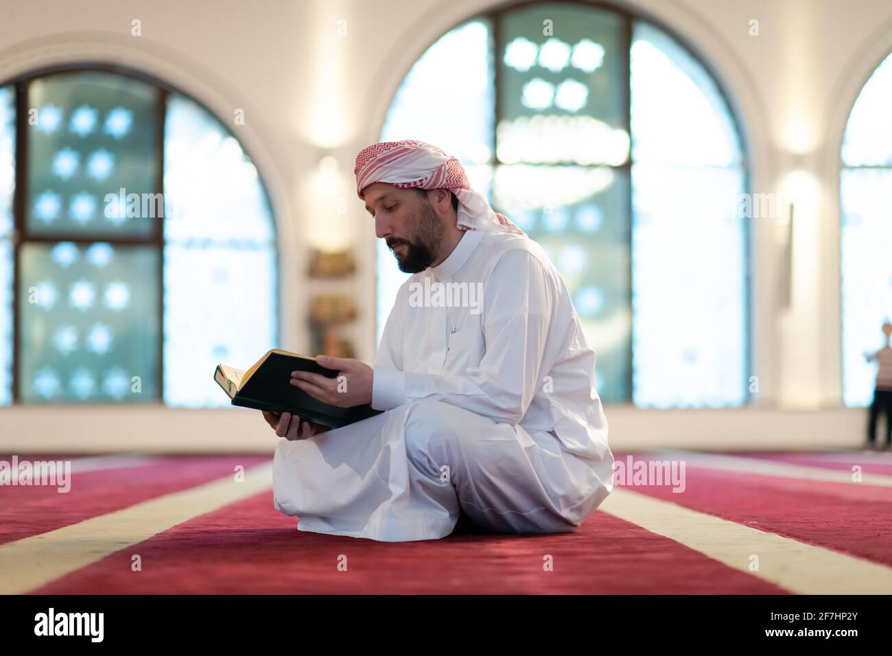 muslim man praying Allah alone inside the mosque and reading islamic ...