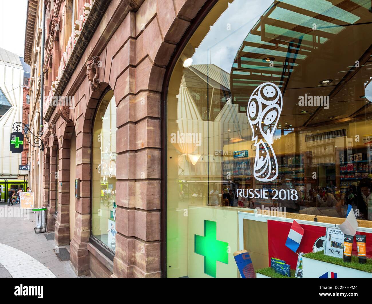 Side view of city and showcase of Drugstore pharmacy in Strasbourg ...