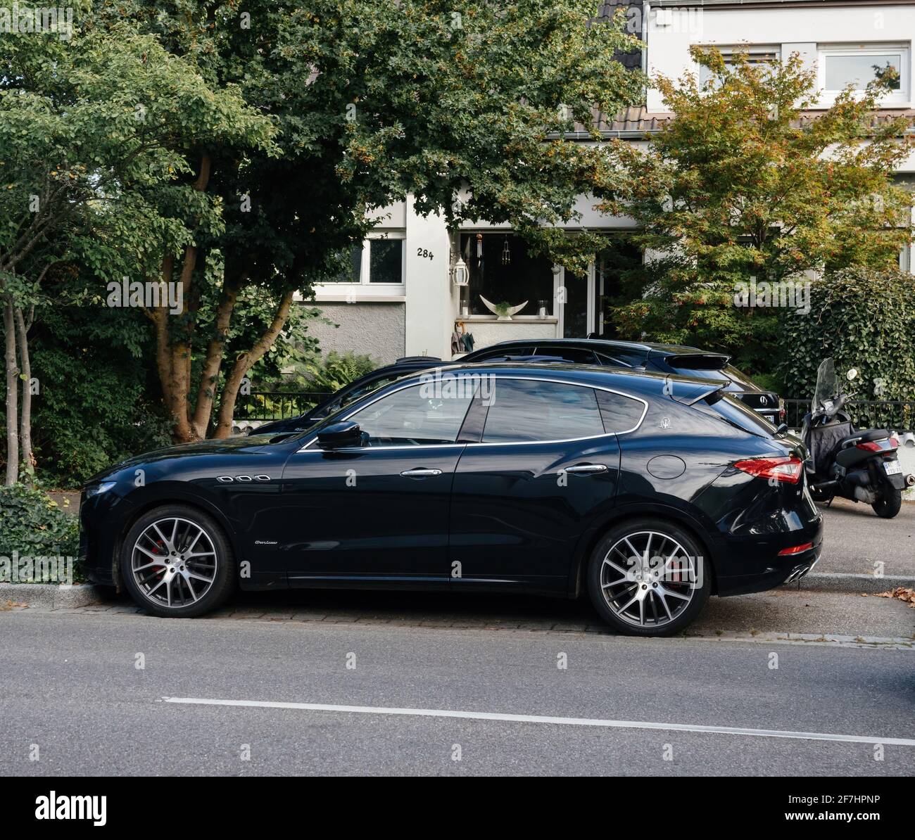 Side view of new black Maserati Levante SUV mid-size luxury crossover ...