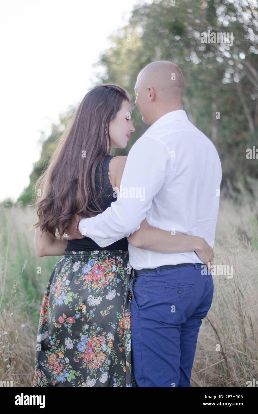 happy couple in love. husband and wife. brunette and bald man in the ...