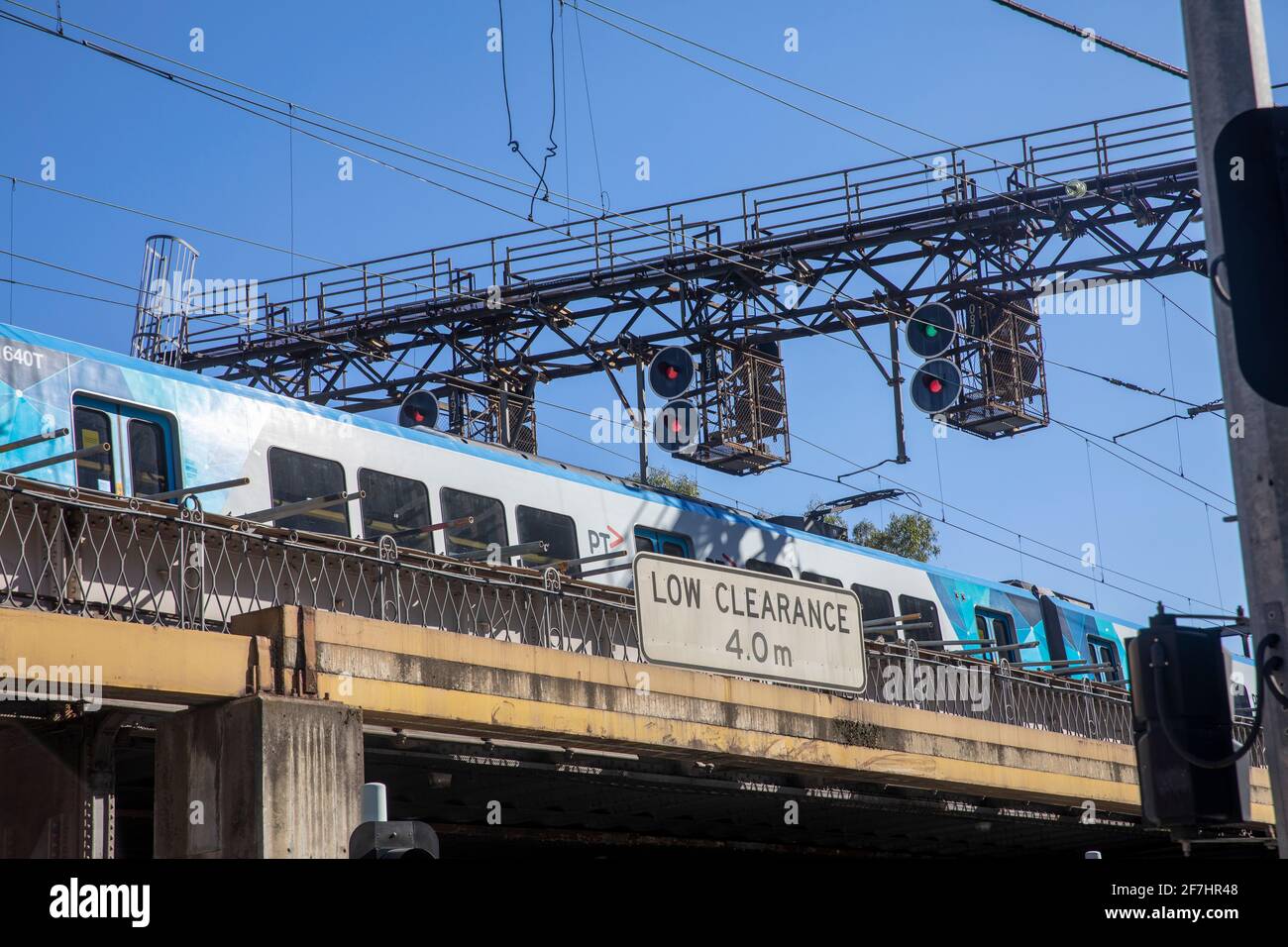 Melbourne metro railway train passing railway signal on the rail ...