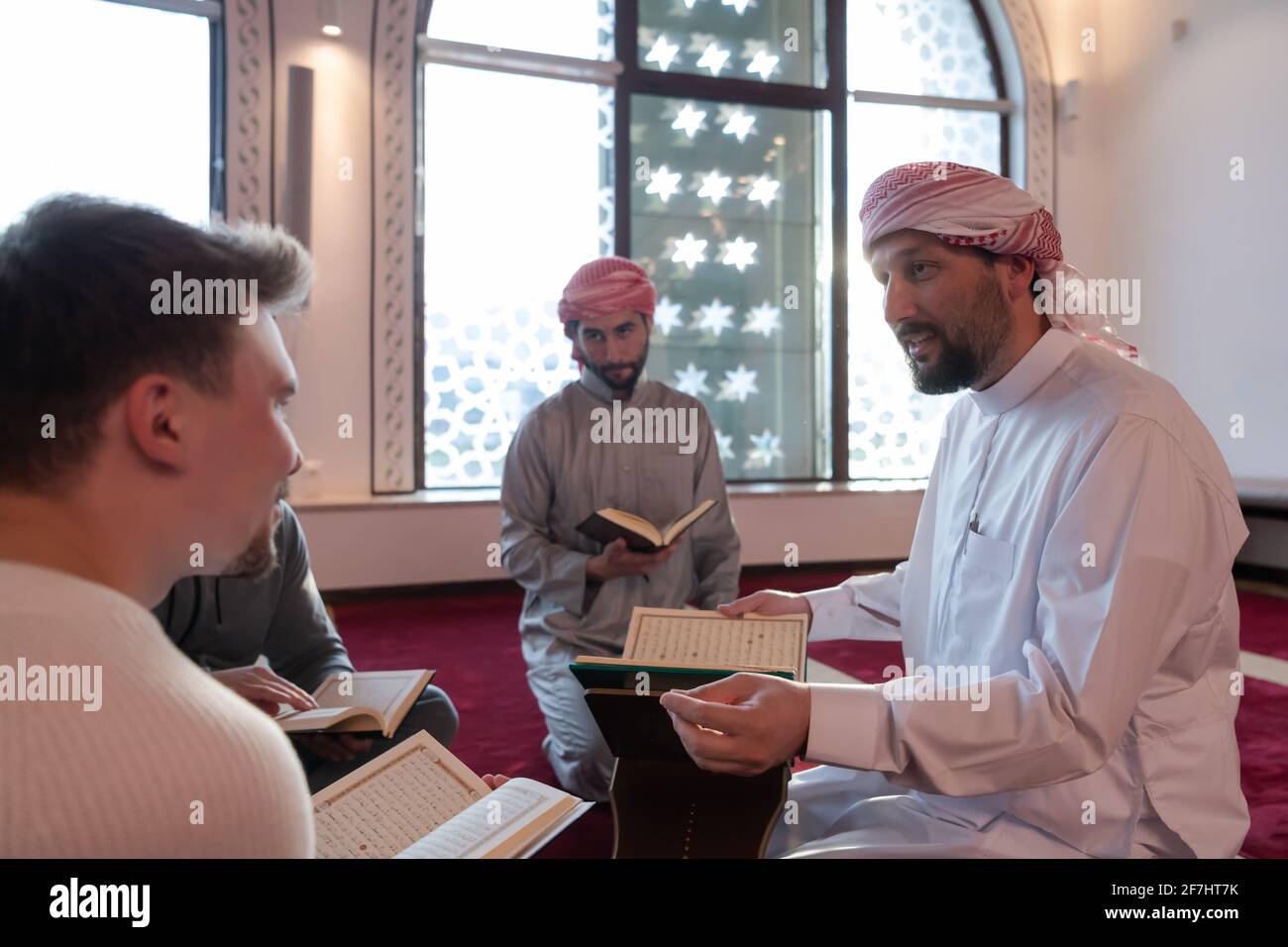 muslim people in mosque reading quran together Stock Photo - Alamy