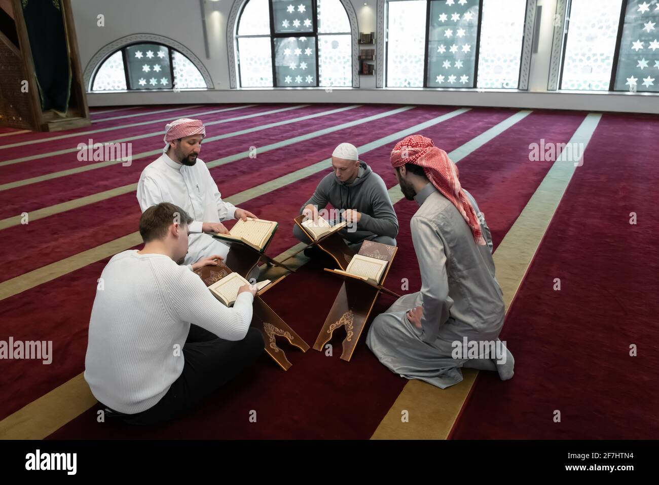 muslim people in mosque reading quran together Stock Photo - Alamy