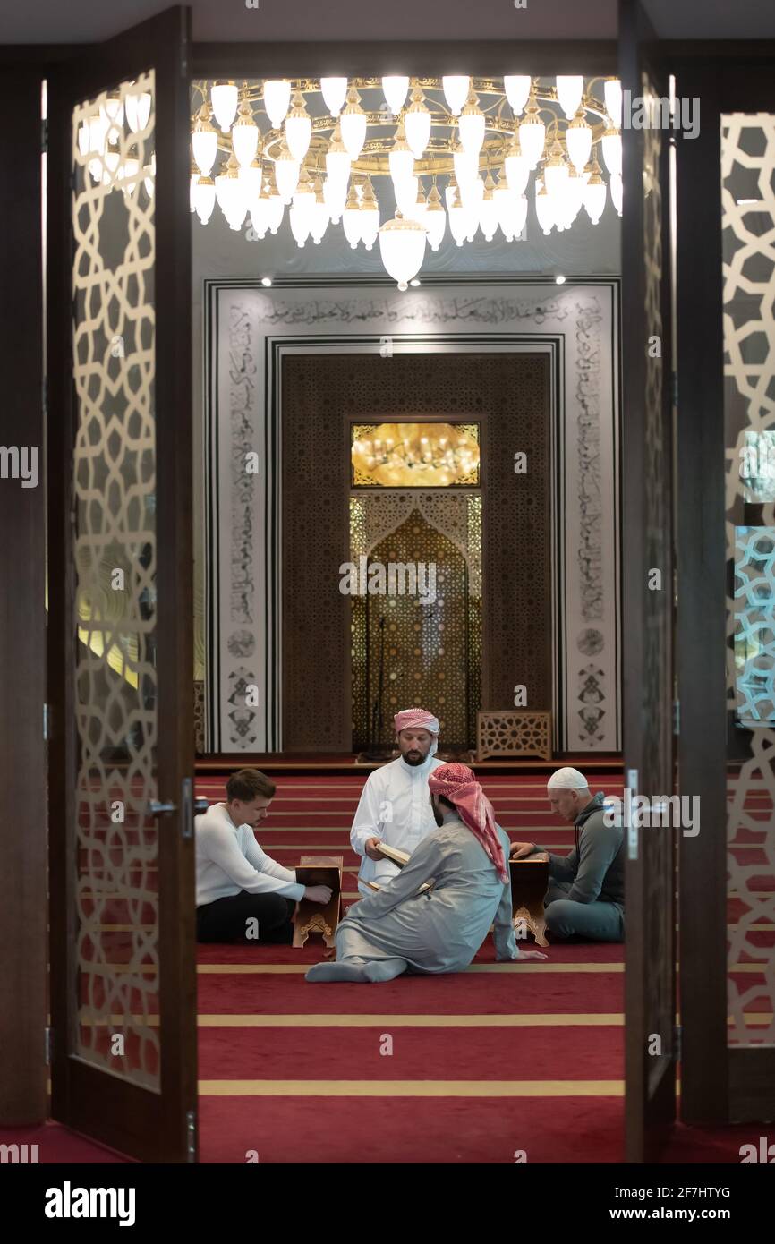 muslim people in mosque reading quran together Stock Photo - Alamy