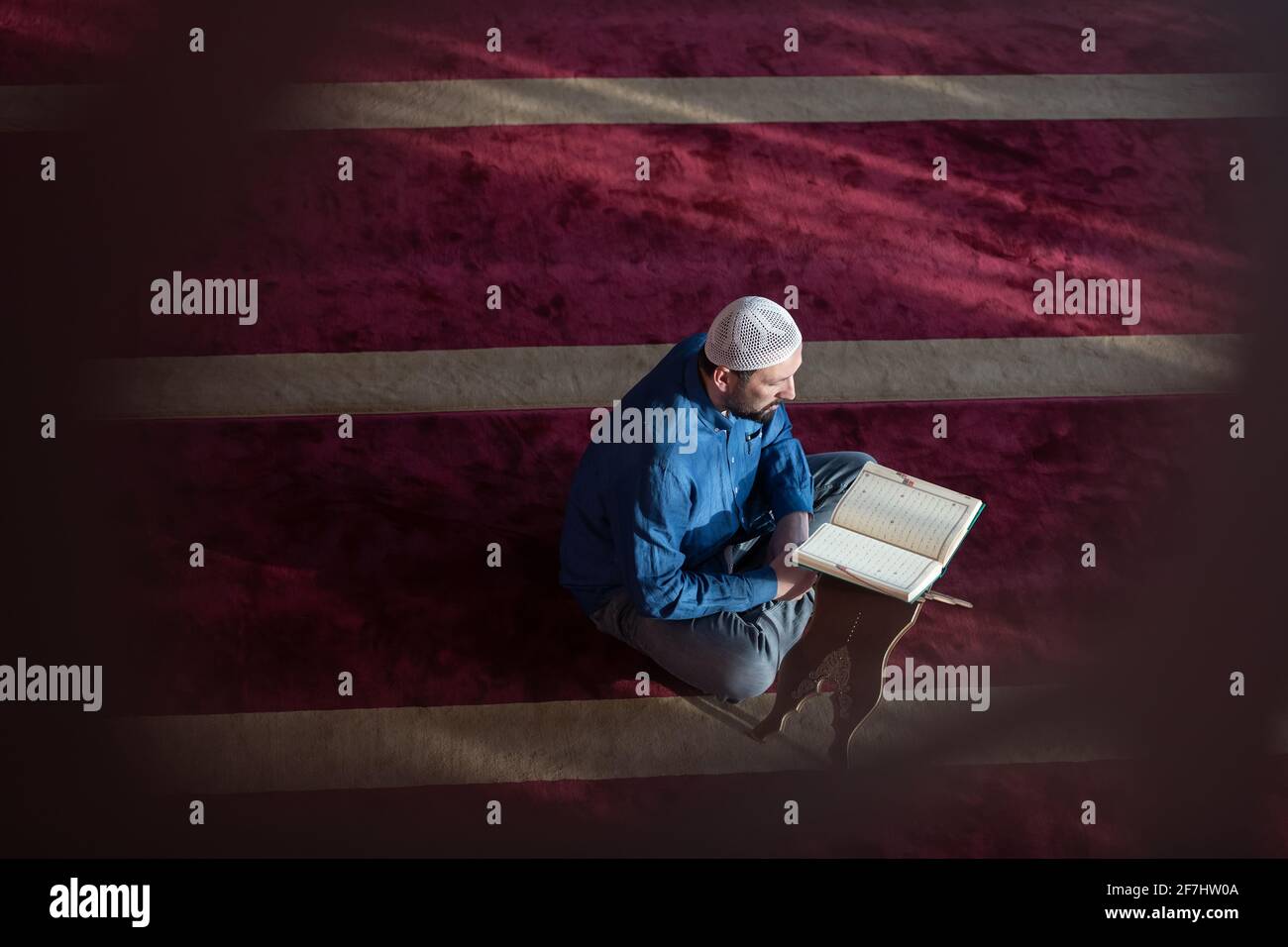 muslim man praying Allah alone inside the mosque and reading islamic ...