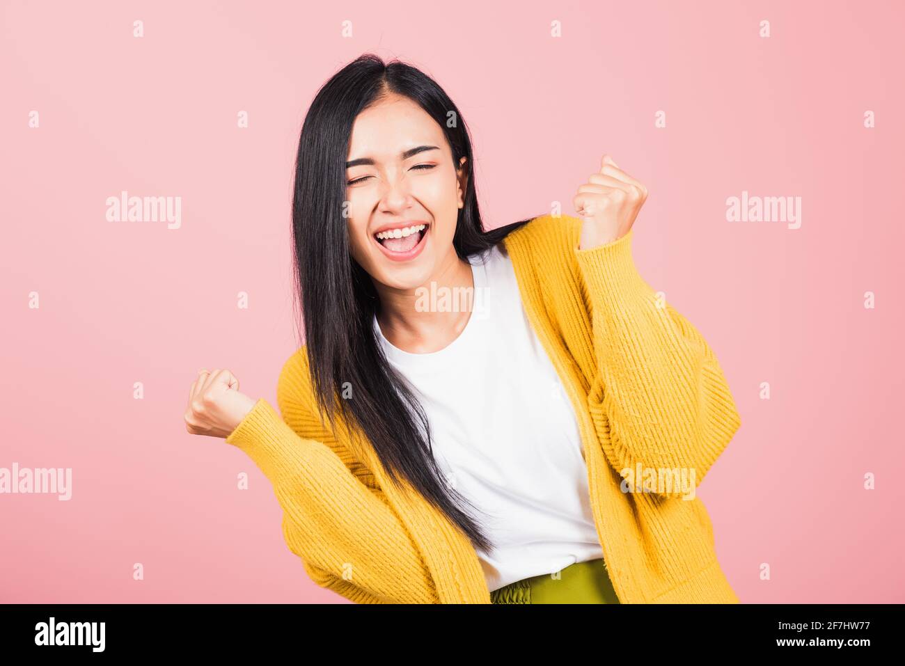 Happy Asian portrait beautiful cute young woman standing winning and ...