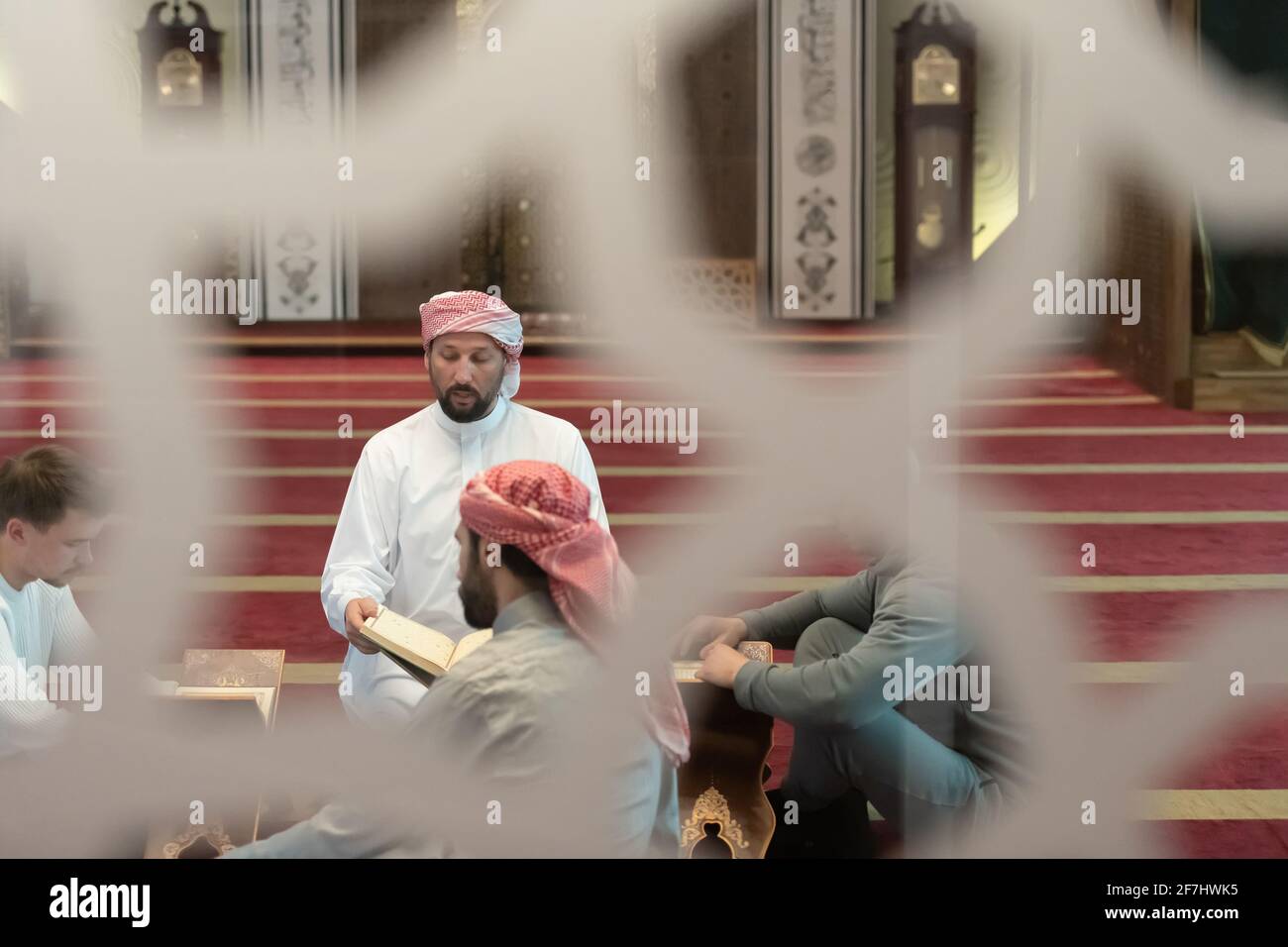 muslim people in mosque reading quran together Stock Photo - Alamy