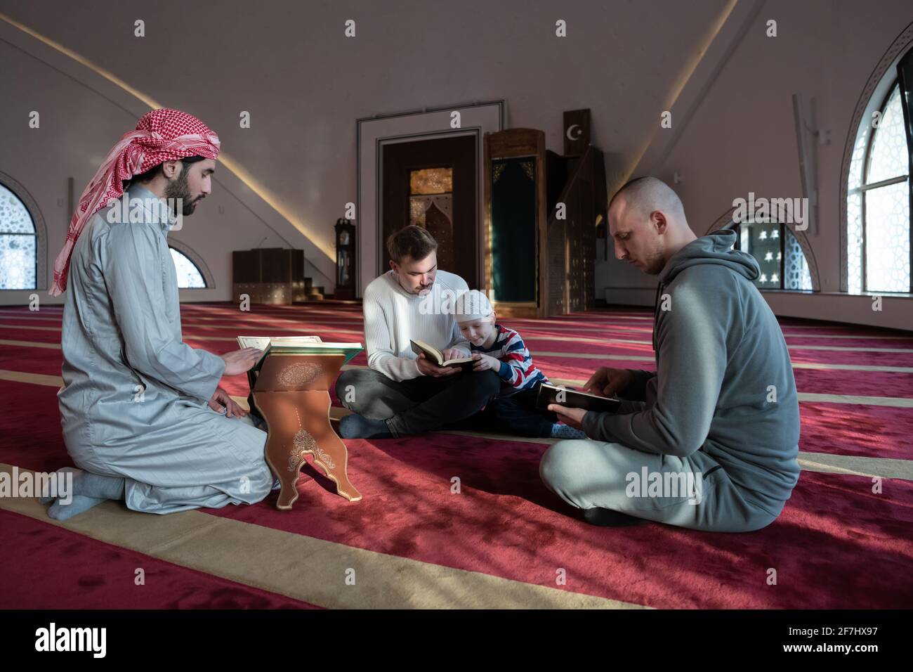 muslim people in mosque reading quran together Stock Photo - Alamy