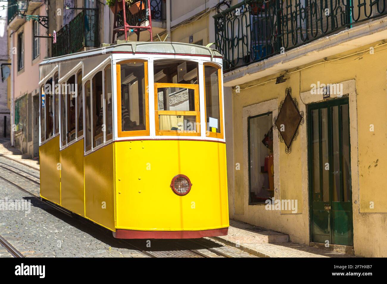 The Gloria Funicular in the city center of Lisbon in a beautiful summer day, Portugal Stock ...